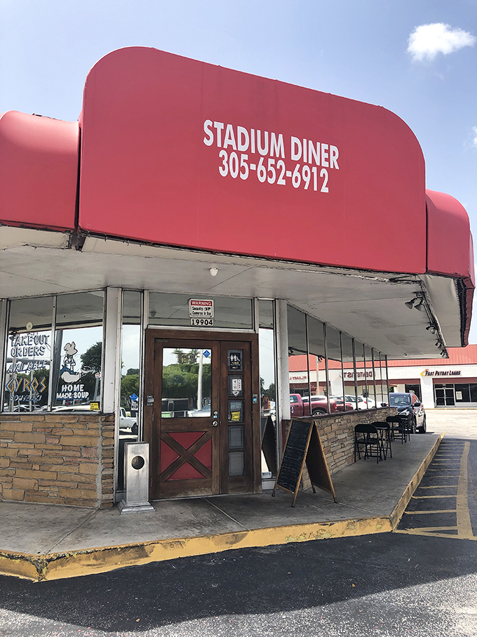 The entrance to flavor town&mdash;complete with stone facade, red door, and a sidewalk chalkboard promising homemade goodness that keeps locals coming back.