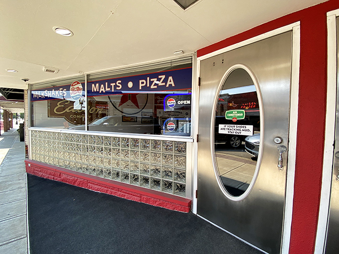 That silver door with its porthole window might as well be labeled "Portal to Flavor Country." The entrance promises adventure for your taste buds.