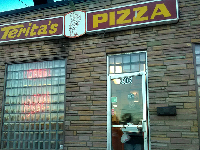 The gateway to pizza nirvana. This humble entrance has welcomed Columbus residents through good times and bad since the Eisenhower administration.