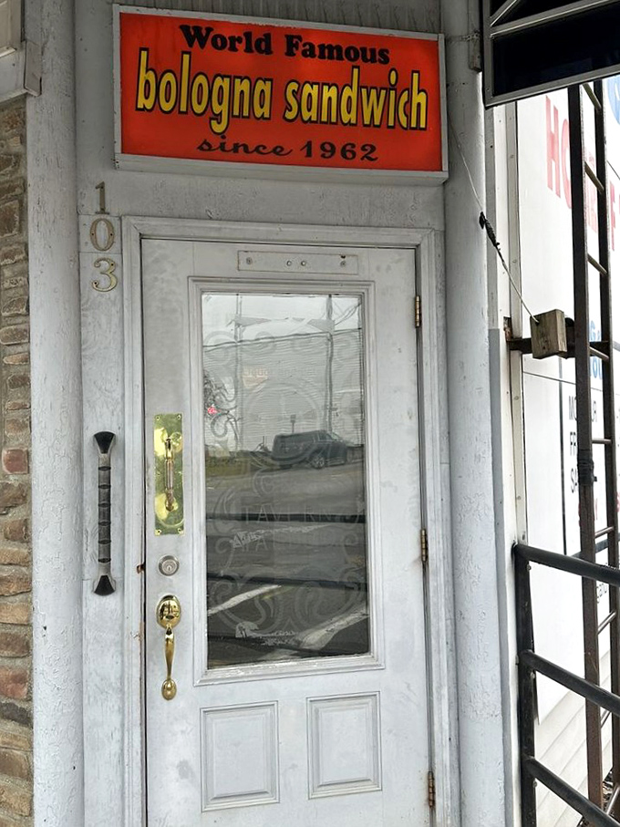 "World Famous bologna sandwich since 1962" &ndash; a door sign that makes more honest promises than most politicians ever will.