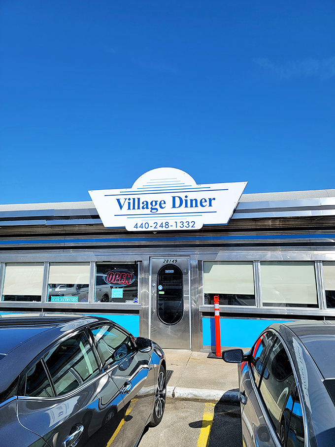 The entrance to Village Diner promises what every good diner should: honest food, zero pretension, and the comfort of culinary consistency.