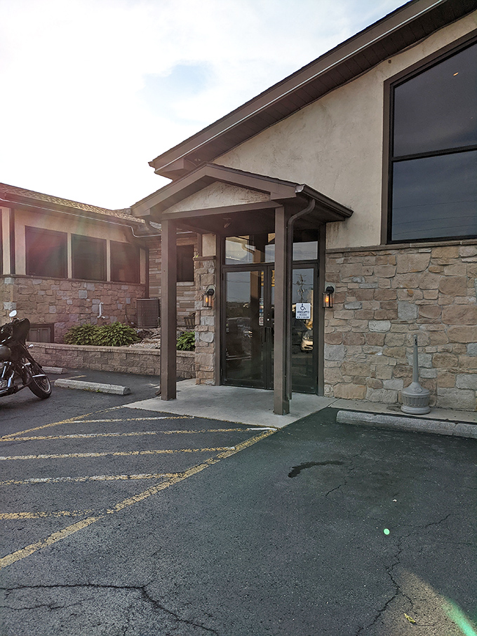 The entrance to meat paradise, where stone meets sunset and hunger meets its match. Your steak journey begins with this unassuming doorway.