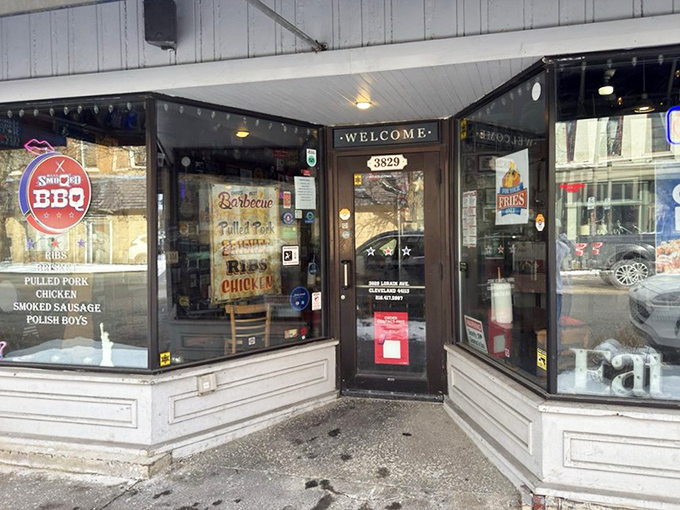 The entrance beckons with promises written on the window &ndash; pulled pork, chicken, smoked sausage &ndash; a preview of the happiness waiting inside.