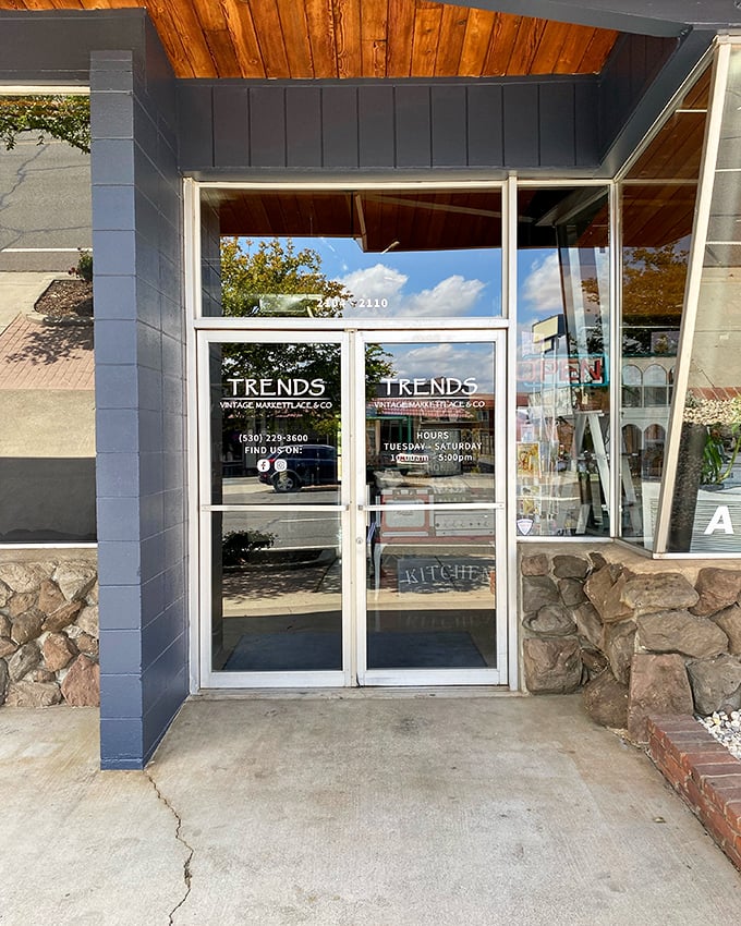 The entrance beckons with promises of vintage treasures within. Those stone accents add just the right touch of mid-century charm.