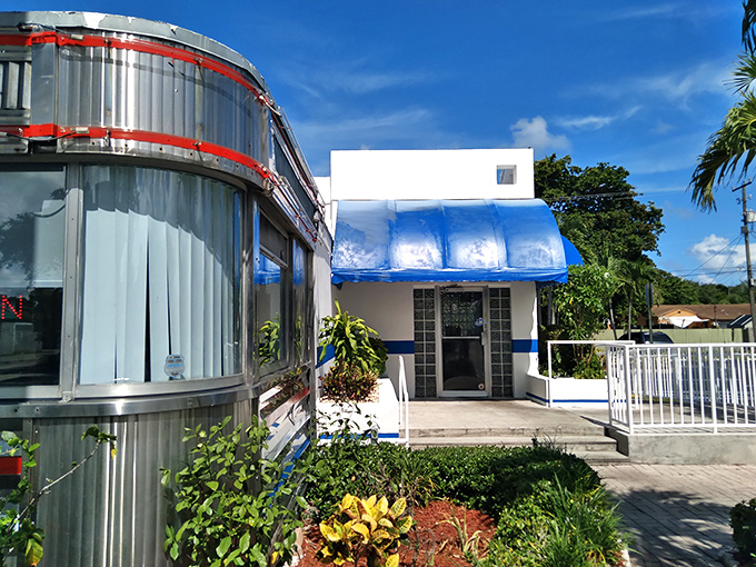 The blue awning and white exterior create that perfect Florida-meets-classic-diner aesthetic. Like a postcard you can actually walk into.
