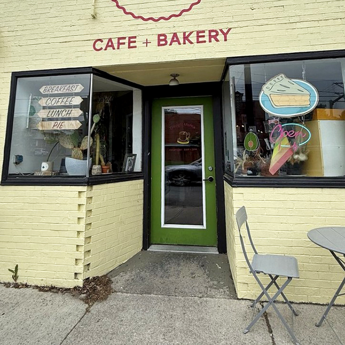 The green door serves as a portal to pastry paradise. Those wooden signs are basically a roadmap to happiness.