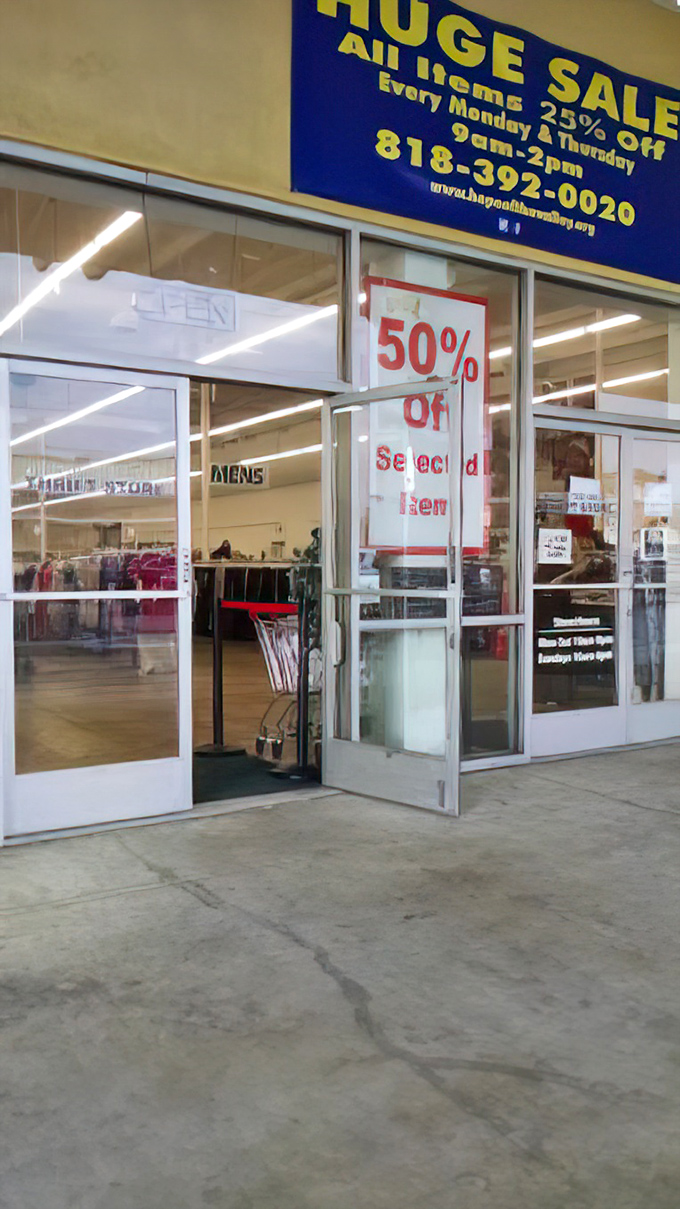 The entrance with its "50% OFF" sign is like the pearly gates for bargain hunters, promising retail salvation within.