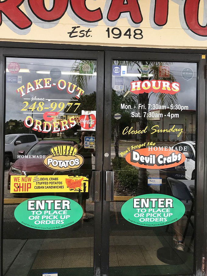 The entrance doors tell you everything you need to know: homemade specialties await inside. These glass portals have welcomed food pilgrims for decades.