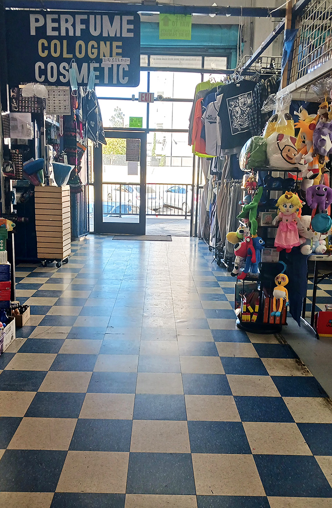 An exit framed by the perfume and cosmetics section. That light at the end of the tunnel? It&rsquo;s the glow of last-minute temptations.