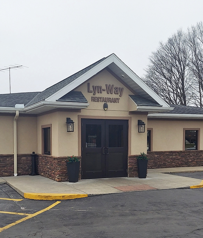 The entrance on a cloudy day still promises sunshine for your taste buds. Those stone accents aren't just decorative&mdash;they're as solid as the restaurant's reputation.