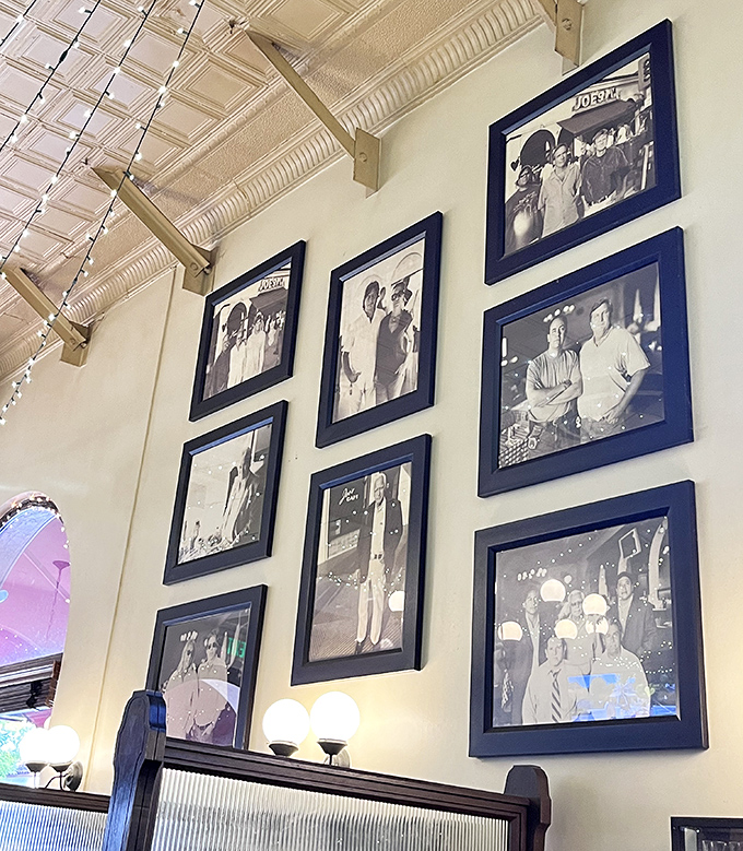 Black and white photographs chronicle decades of Santa Barbara history, serving as silent witnesses to countless meals and memories made beneath them.