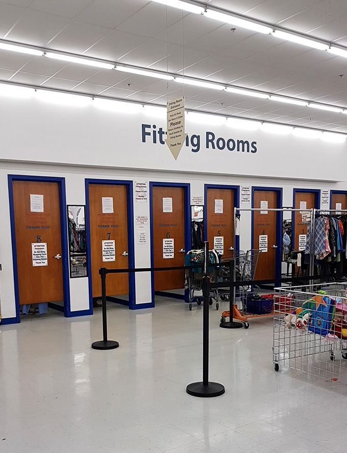 Fitting rooms that respect the sacred ritual of trying before buying. The moment of truth awaits behind those blue-trimmed doors.