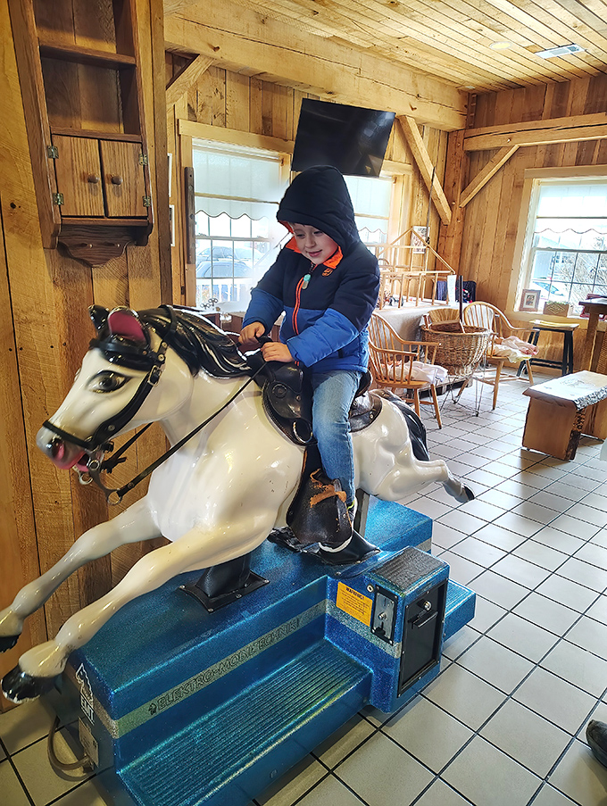 Even the youngest visitors find joy at Gasthof, where this mechanical horse ride offers entertainment between helpings of home-cooked goodness. 