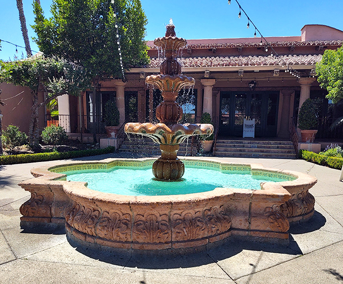 The courtyard fountain provides a moment of tranquility before the serious business of steak consumption begins. Spanish colonial elegance in the California sun.