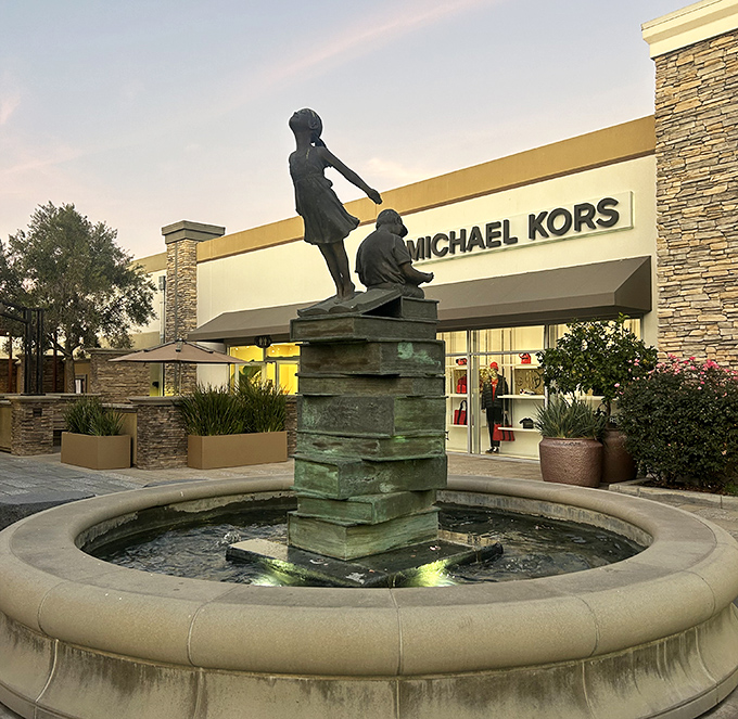 Michael Kors backdrop for a moment of retail zen. This fountain offers shoppers a peaceful interlude between bouts of discount hunting.