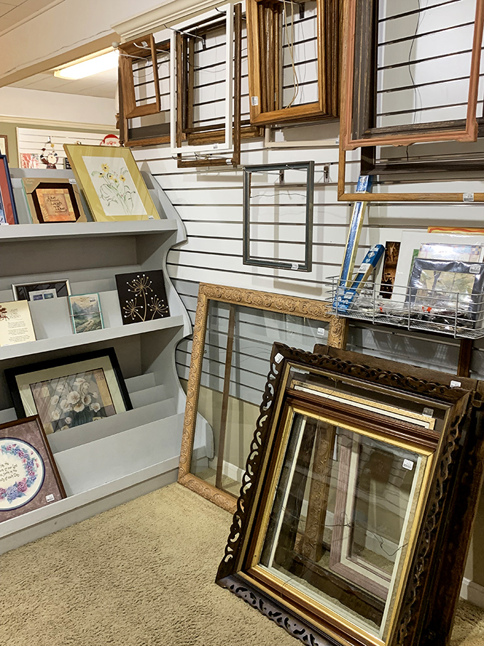 Picture frames waiting for new memories to hold. The ornate gold one probably displayed someone's wedding photo for thirty years.
