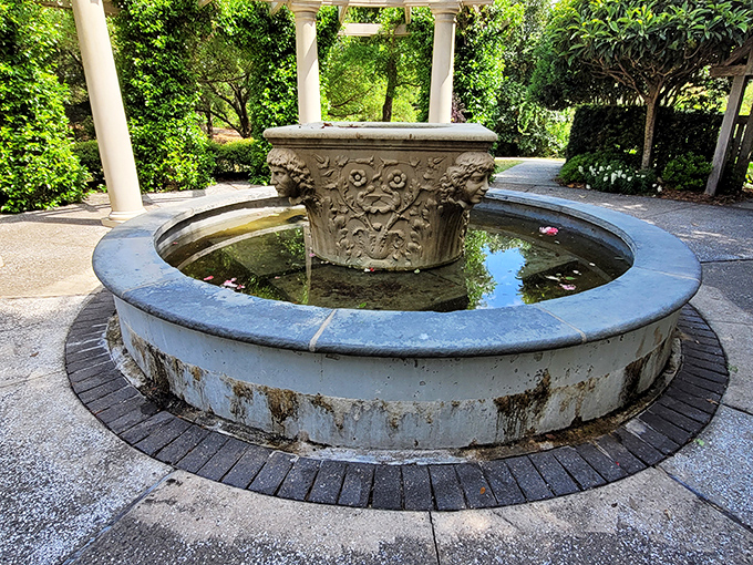 This classical fountain creates a meditative focal point, its weathered stone telling tales of countless wishes made in its reflecting waters.
