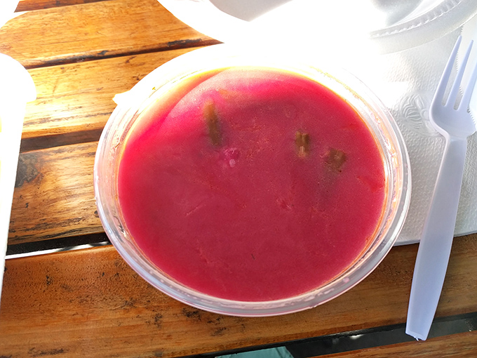 The vibrant crimson of homemade borscht practically sings from the container. This isn't just soup&mdash;it's liquid cultural heritage with a side of earthy sweetness.