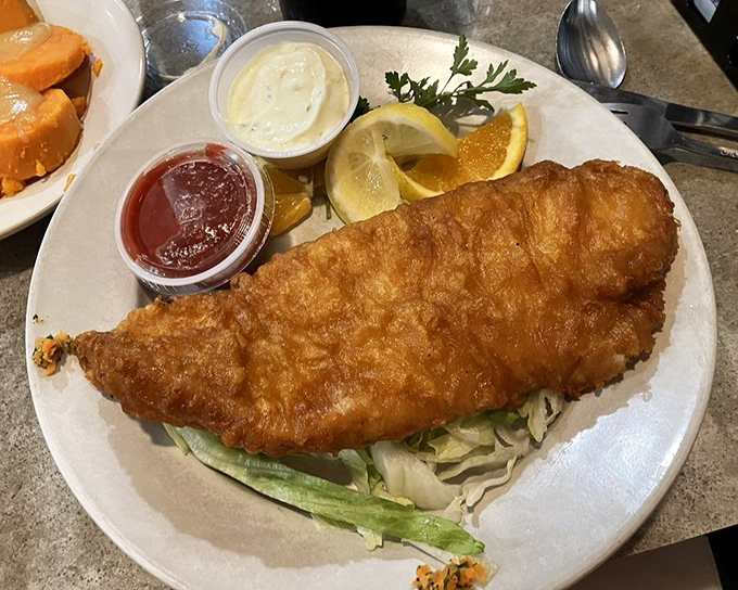 Golden-battered fish that makes you wonder if mermaids do the cooking. The perfect crunch-to-flake ratio is culinary mathematics at its finest.