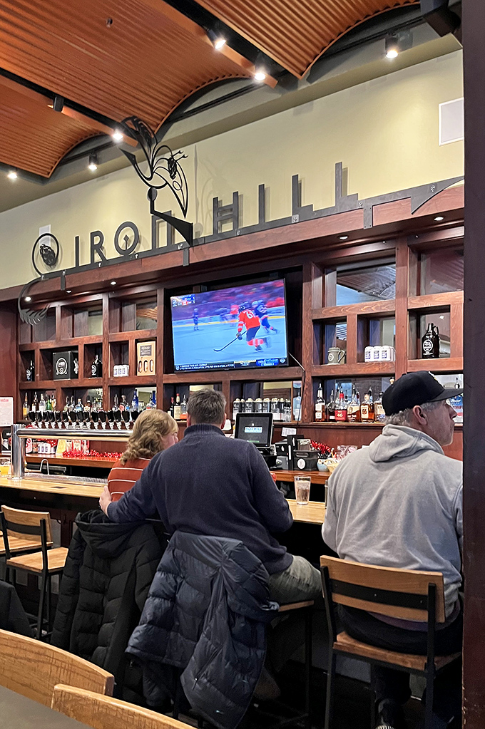 The bar where strangers become friends and hockey becomes a shared religion. A front-row seat to both the game and expert bartending.