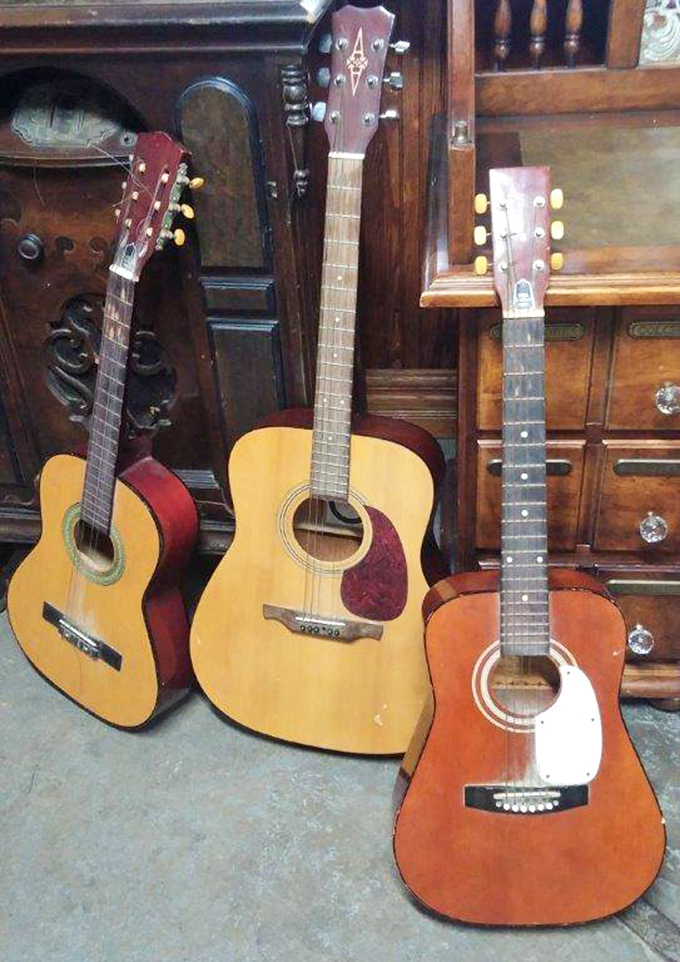 String theory in action! These acoustic guitars aren't just instruments&mdash;they're vessels of potential campfire sing-alongs and late-night serenades waiting to happen.