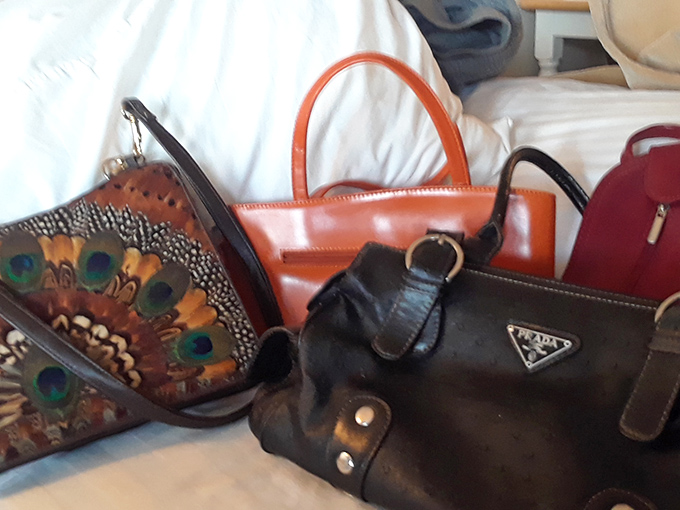 Designer handbags nestled together like old friends at a reunion &ndash; each with stories to tell and years of fashionable life still ahead.