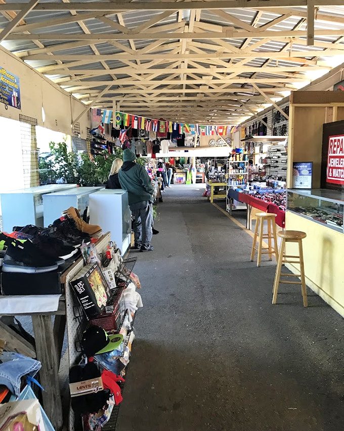 International flags hang proudly above this indoor corridor, a silent testament to the global influences that make this market a cultural crossroads.