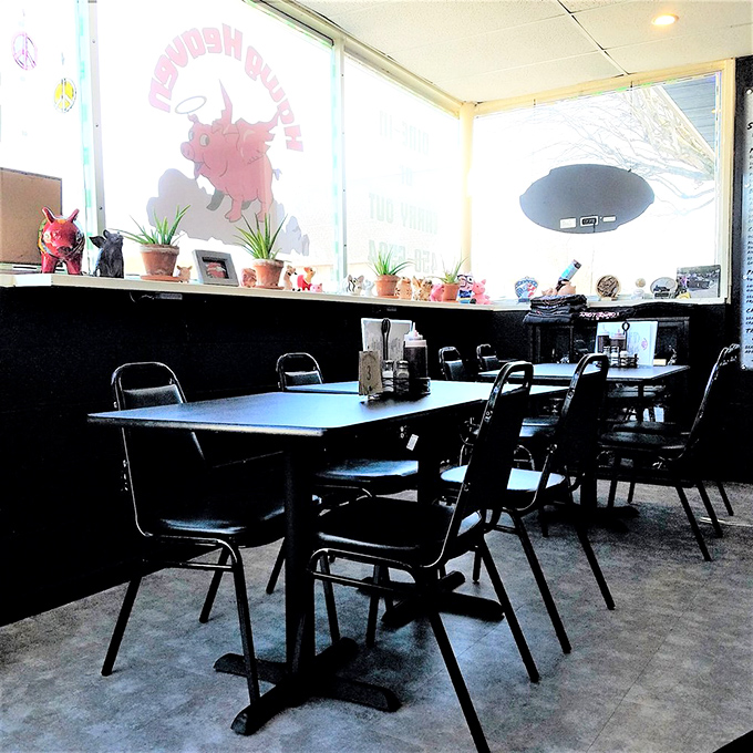 Sunlight streams through windows illuminating simple tables where life-changing BBQ memories are made. Notice the pig collectibles standing guard.