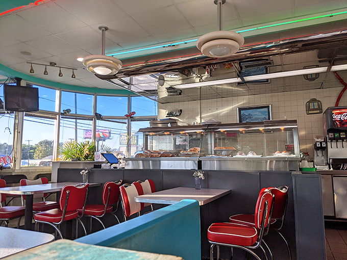 Red and turquoise create the perfect retro color palette. These booths have witnessed first dates, family celebrations, and countless "I shouldn't but I will" dessert decisions.