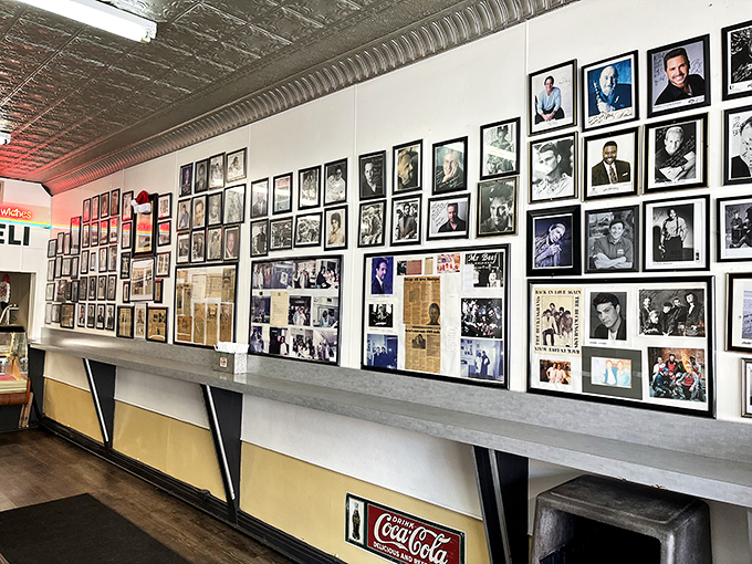 The wall of fame showcases decades of celebrity pilgrims who've made the journey to this beef sanctuary, immortalized in black and white.