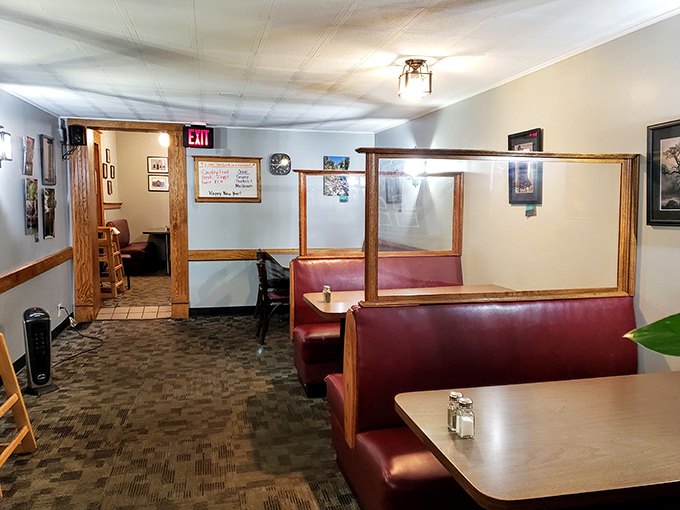 The dining room's dividers create little islands of conversation, each booth a private sanctuary for the serious business of eating well.