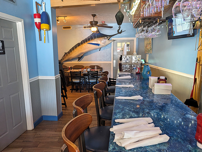 The blue marlin watches over diners like the restaurant's unofficial mascot. He's seen thousands of happy meals and kept all the delicious secrets.