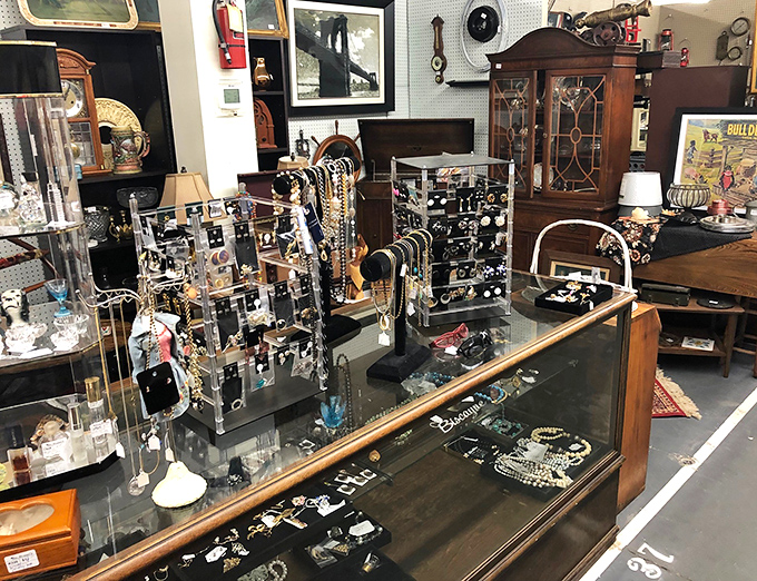 Jewelry displays glittering with possibilities, where someone else's past statement piece waits to become your future conversation starter.