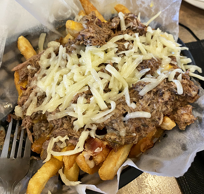 Loaded fries&mdash;where potatoes fulfill their highest calling, crowned with savory pulled meat and melted cheese in a glorious celebration of excess.