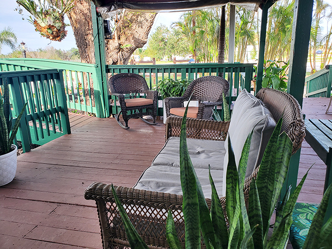 Wicker furniture and potted plants create a front porch feel. The kind of place where sweet tea and conversation flow freely.