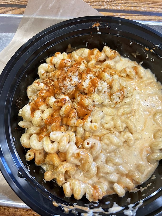 Mac and cheese that's achieved creamy perfection. That subtle seasoning and sauce drizzle elevates this comfort classic from side dish to main event contender.