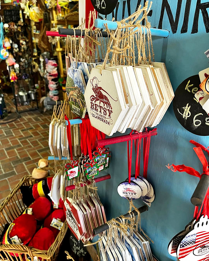 The Rain Barrel sign stands tall against the brilliant blue Florida sky, directing travelers to food, shopping, and one enormous lobster.