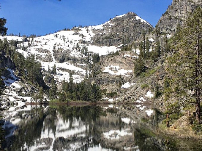 These peaks have been standing guard over the lake since before your grandparents' grandparents were even a thought.