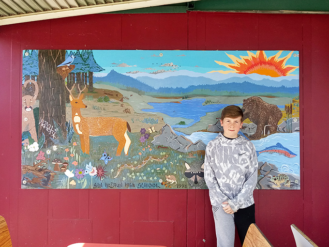 Local artwork adds character to the walls, because even drive-ins deserve a touch of culture.