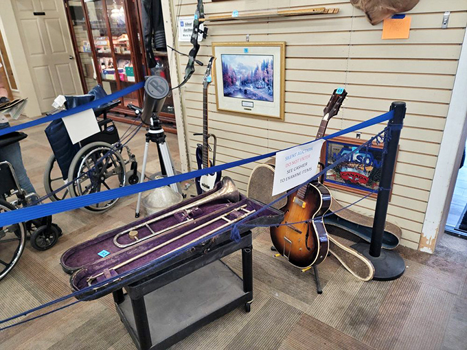 Musical instruments patiently waiting for their encore performance. That guitar has probably played more "Wonderwall" than it cares to admit.