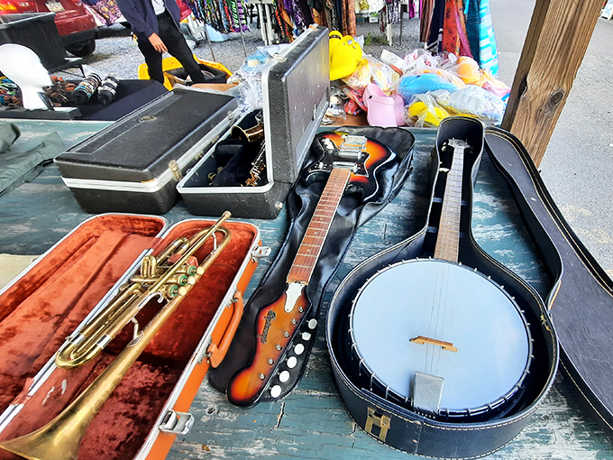 Musical instruments awaiting their next performance. That sunburst guitar could be the beginning of someone's rock star dreams or midlife crisis band.