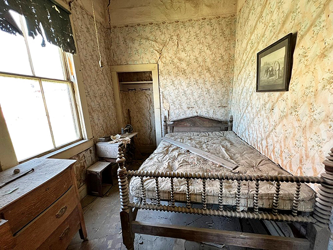 A brass bed frame guards memories of dreams both sweet and restless in this high-altitude bedroom.