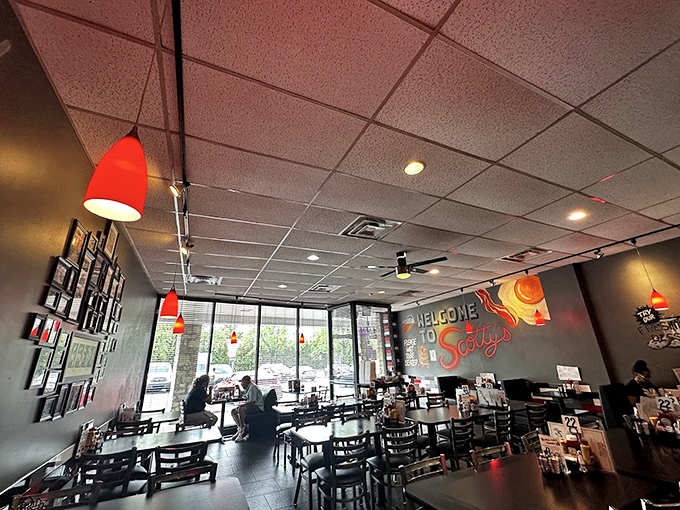 Red pendant lights cast a warm glow over tables where friendships are strengthened, deals are made, and the important decision of pancakes versus waffles is debated daily.