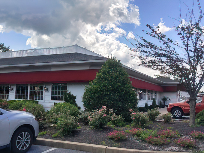 Even the parking lot landscaping tries harder than most restaurants' interior design - those flowers mean business.