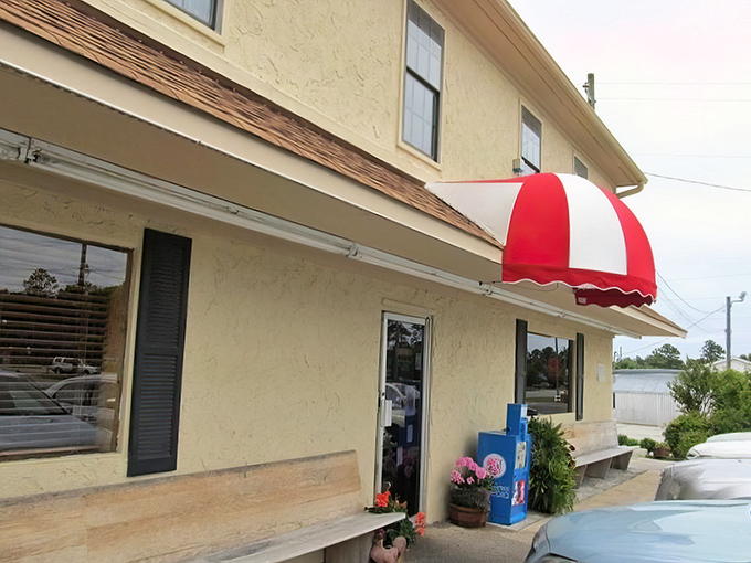 The red and white awning signals your arrival at flavor town. Simple exterior, extraordinary food within.