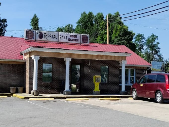 The red-roofed restaurant with white columns stands ready for another day of serving hungry travelers and locals&mdash;a humble temple of breakfast devotion.