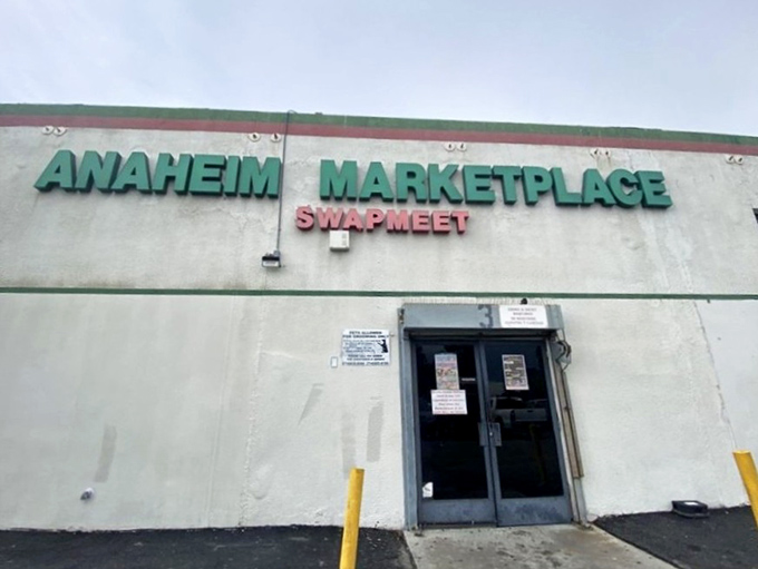 The other entrance to wonderland&mdash;where the sign promises "Swapmeet" but delivers an entire cultural expedition without the passport requirements.