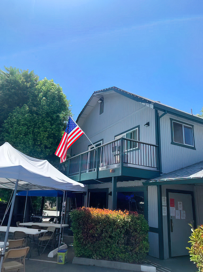 Outdoor seating under California blue skies, where the American flag waves as if to say, "This is how we do comfort food."
