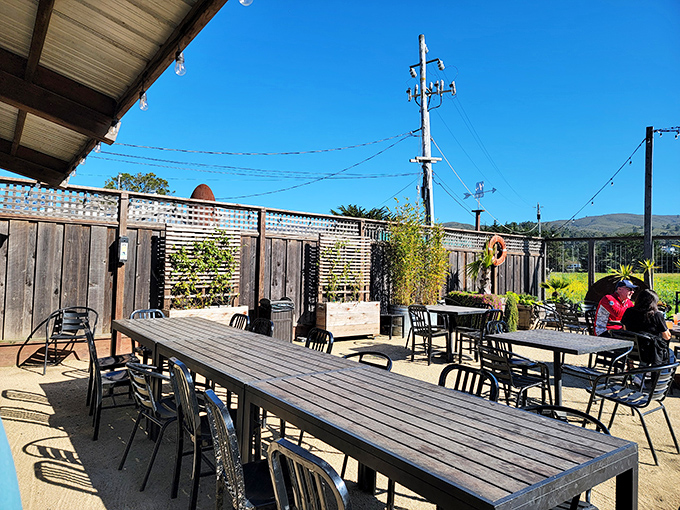 Outdoor seating where the ocean breeze does double duty as both air conditioning and appetite enhancer. Nature's perfect dining companion.