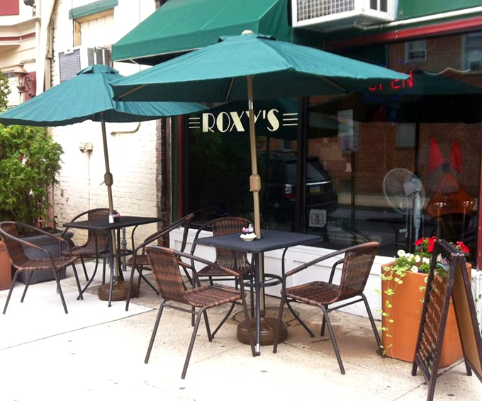 Outdoor seating that turns sidewalk dining into an event. Those green umbrellas are urban oases in Pennsylvania's capital city.